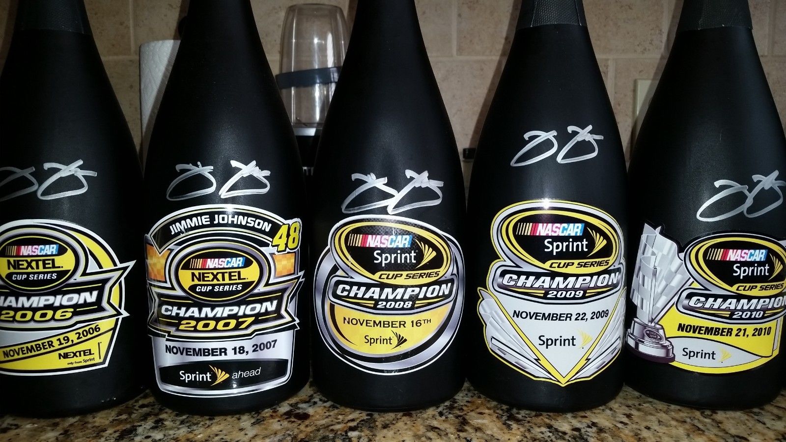 JIMMIE JOHNSON signed and unopened championship champagne bottles ...